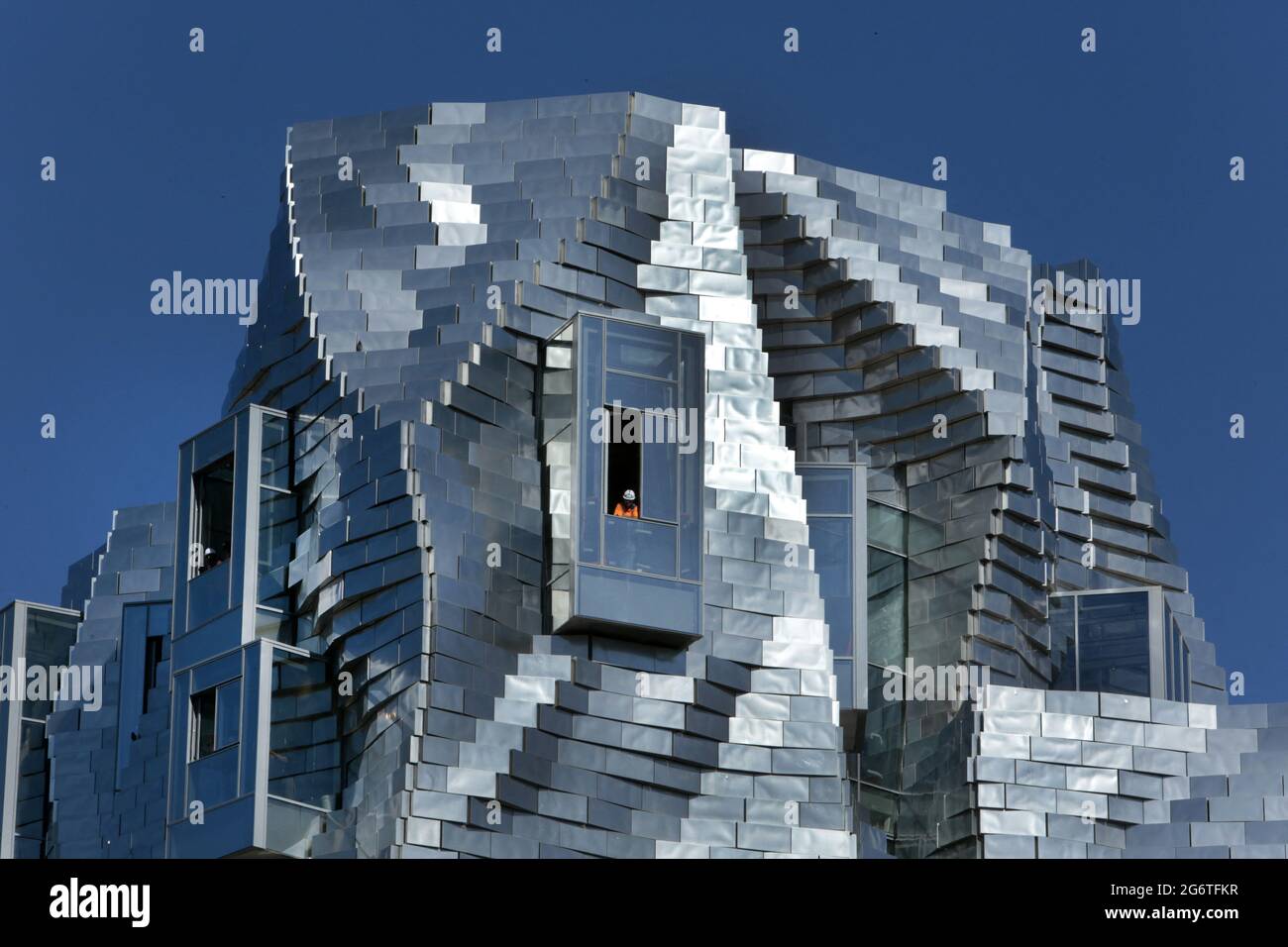 The twisting Luma tower clad in reflective aluminium tiles, designed by ...