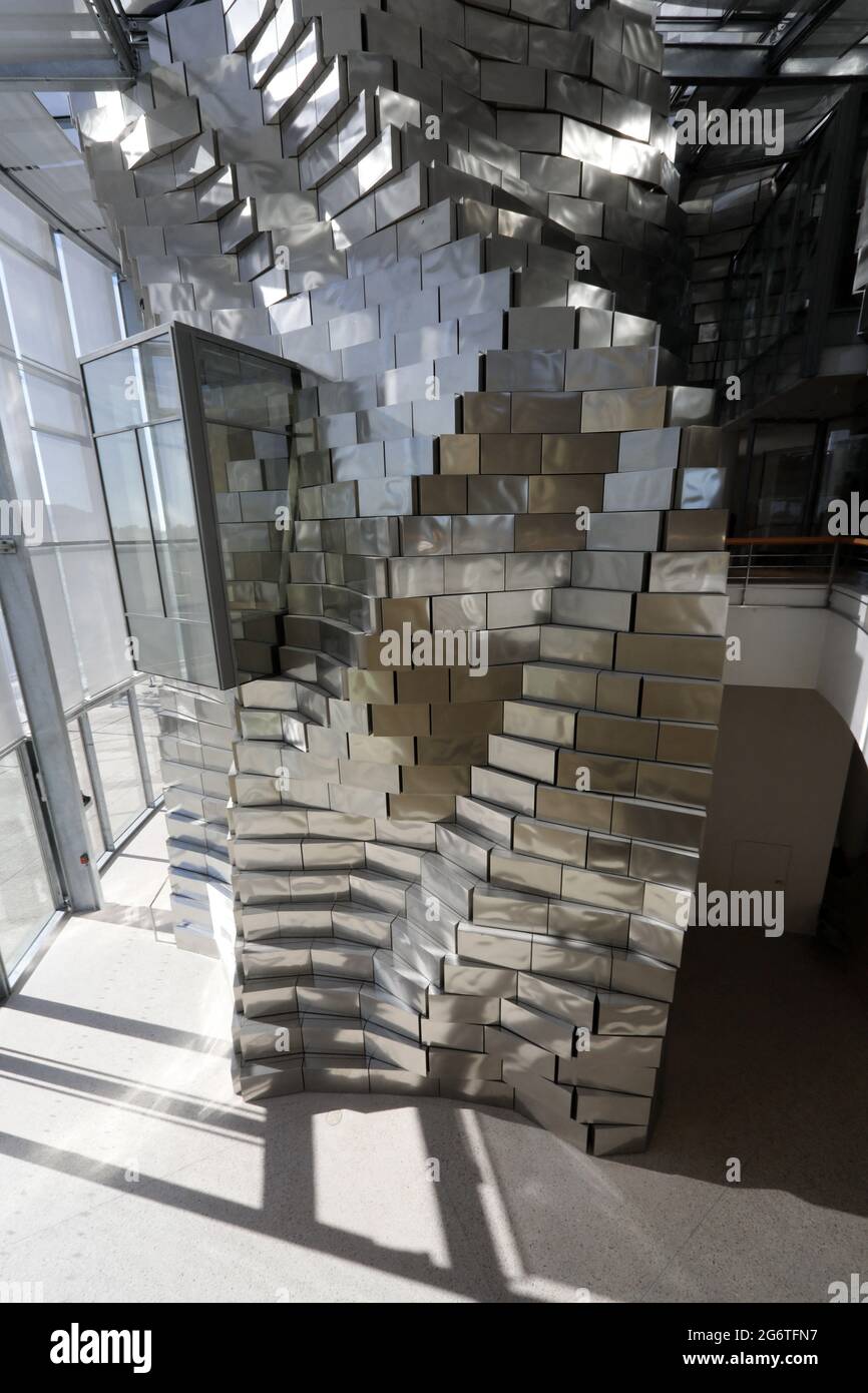 The twisting Luma tower clad in reflective aluminium tiles, designed by ...