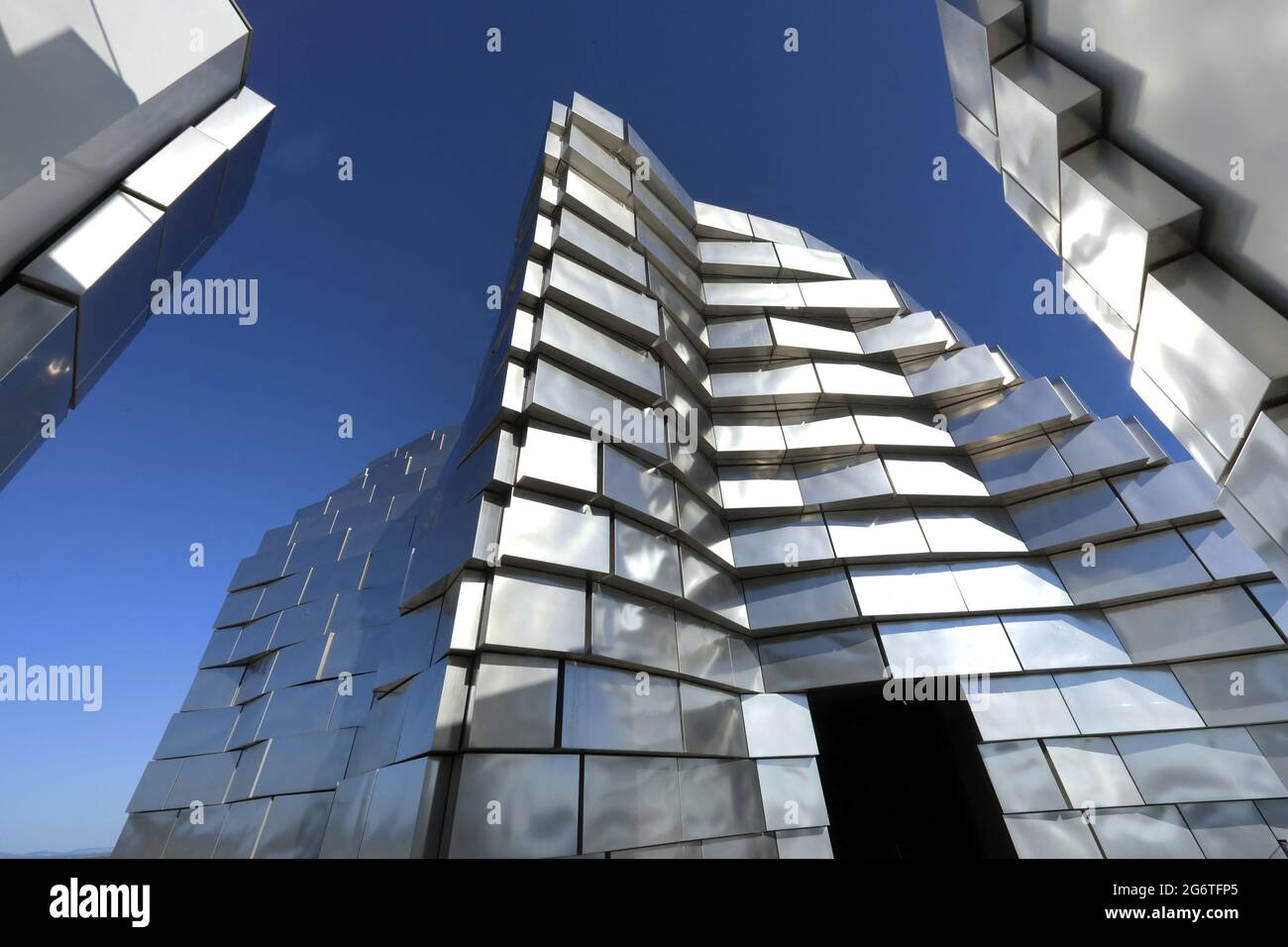 The twisting Luma tower clad in reflective aluminium tiles, designed by ...