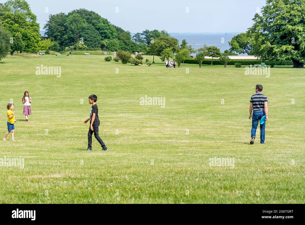 Aarhus, Denmark - 27 June 2021: People are on a picnic and walk in the ...