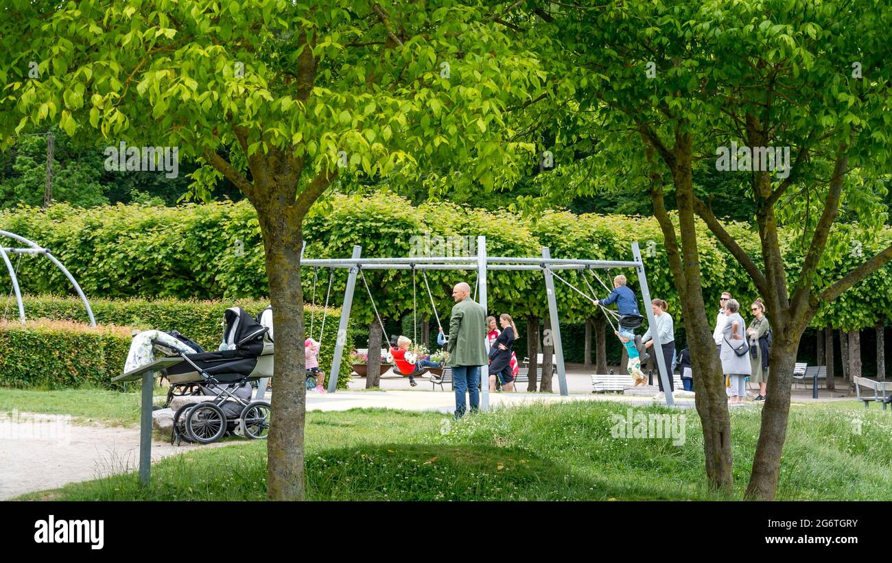 Aarhus, Denmark - 27 June 2021: People are on a picnic and walk in the ...