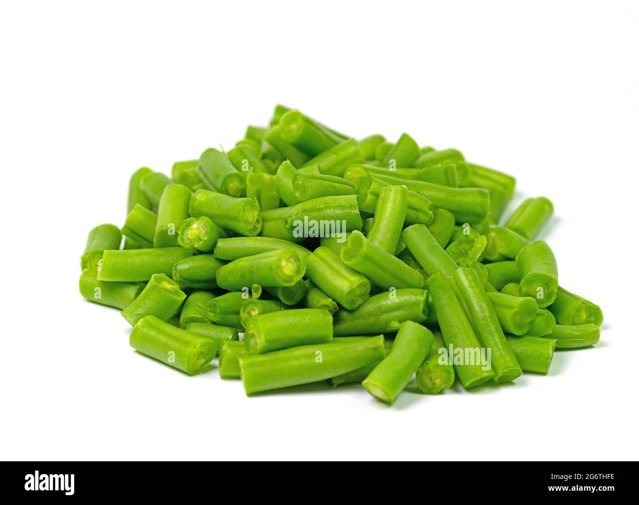 Green beans, cut, against white background Stock Photo - Alamy