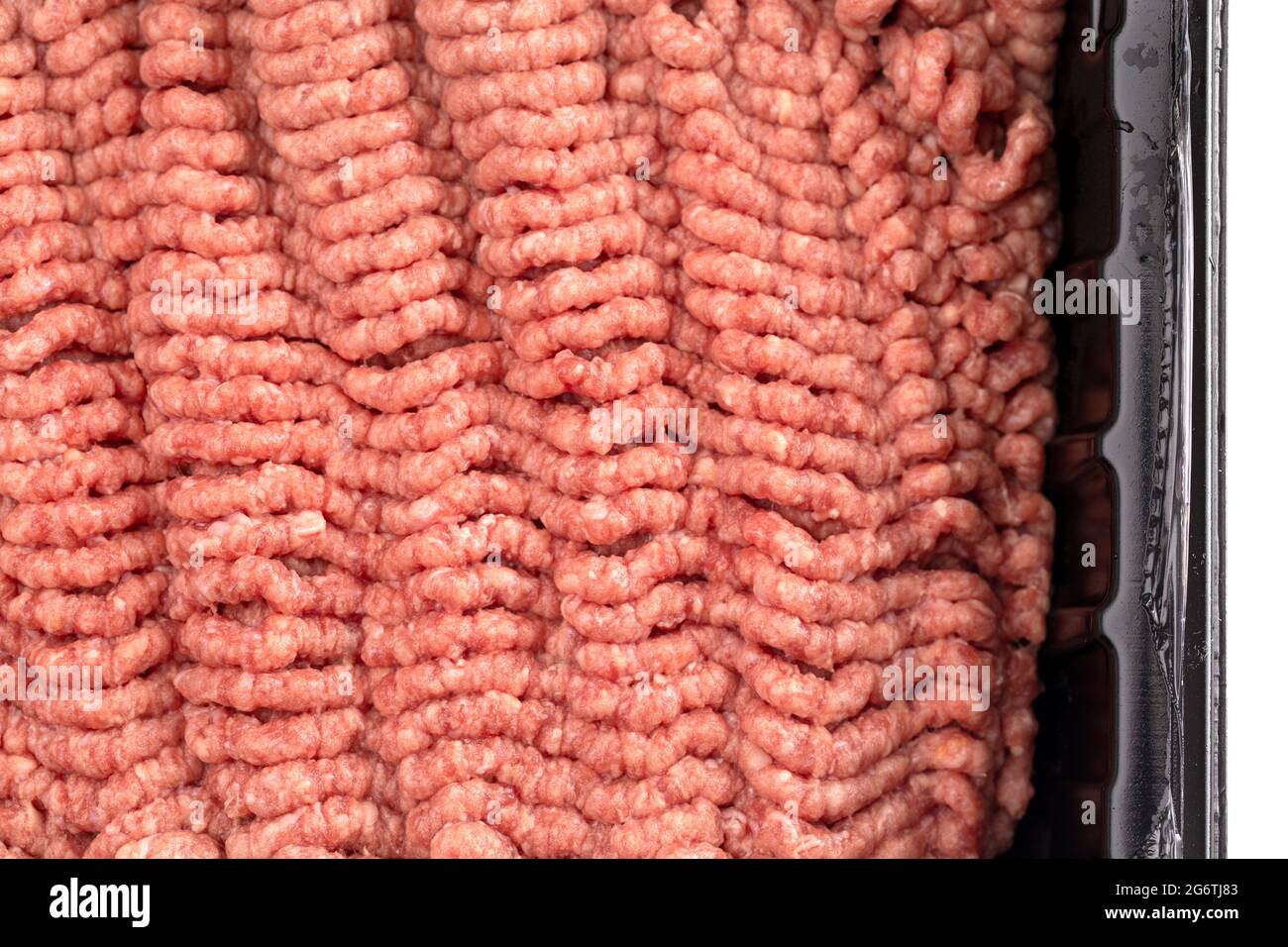 Raw Hamburger Meat in a Plastic Package Isolated on a White Background ...