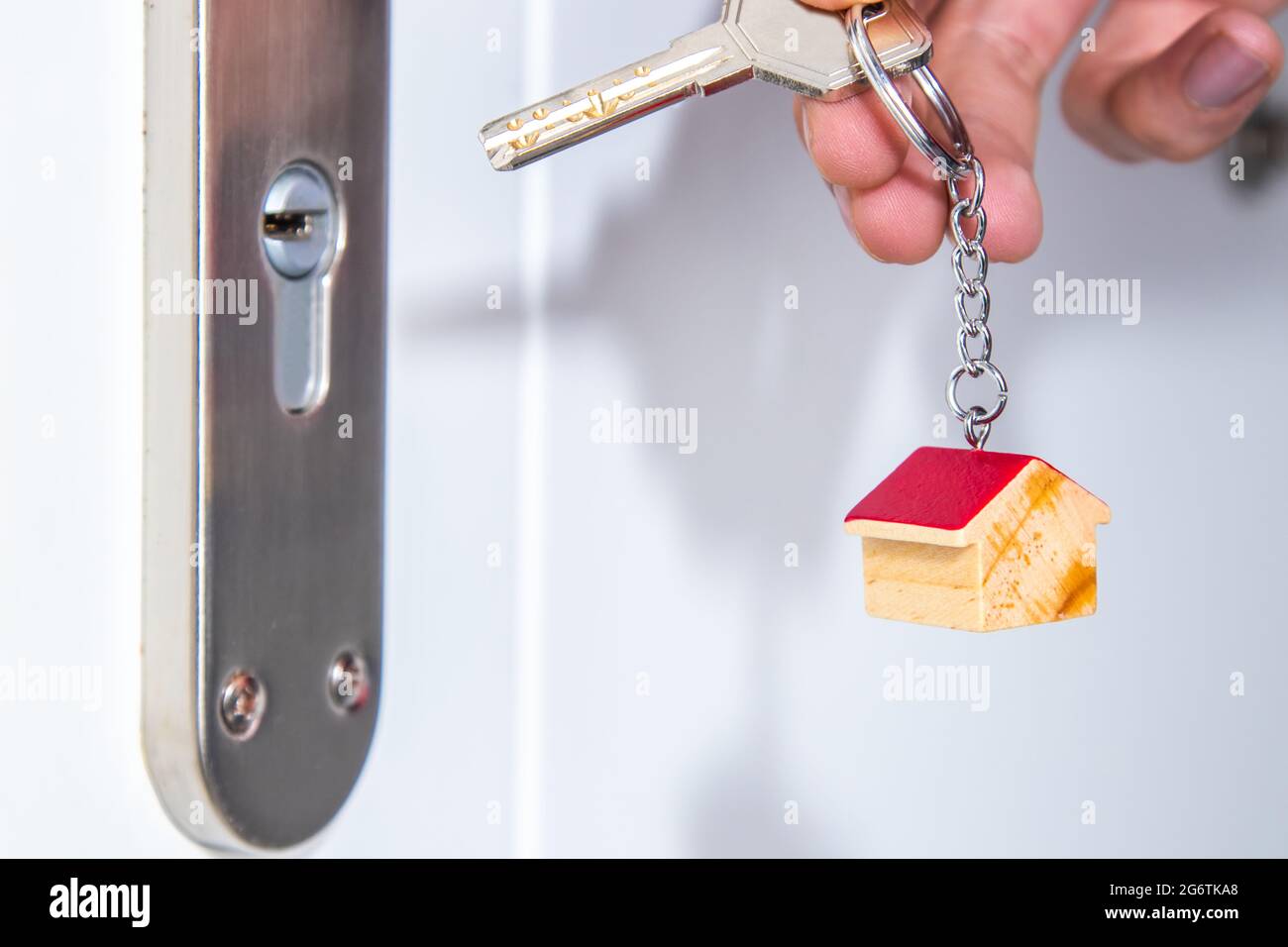 hand with key in the door lock Stock Photo - Alamy