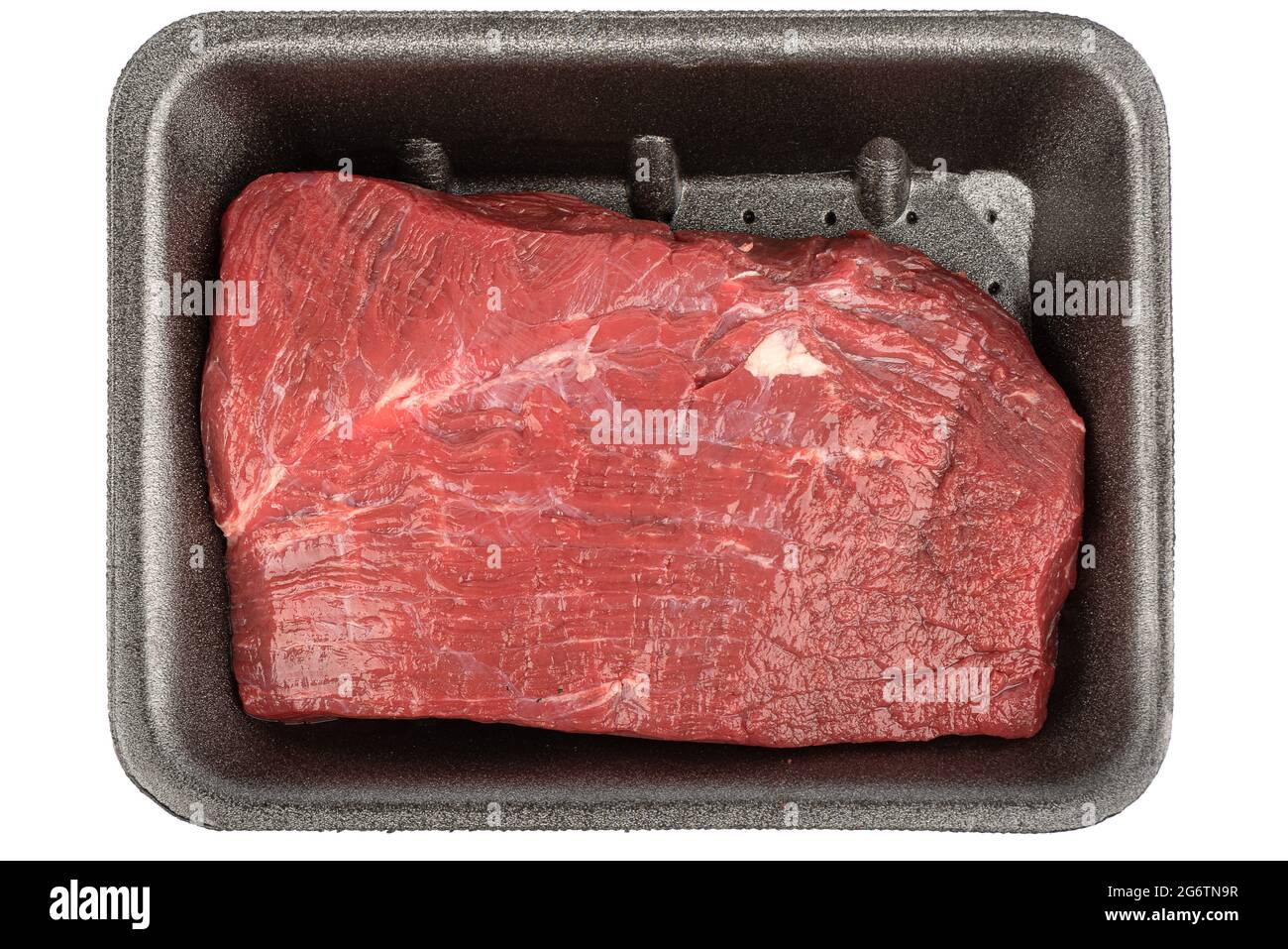 Fresh boneless beef meat in a plastic tray over white background. Top ...
