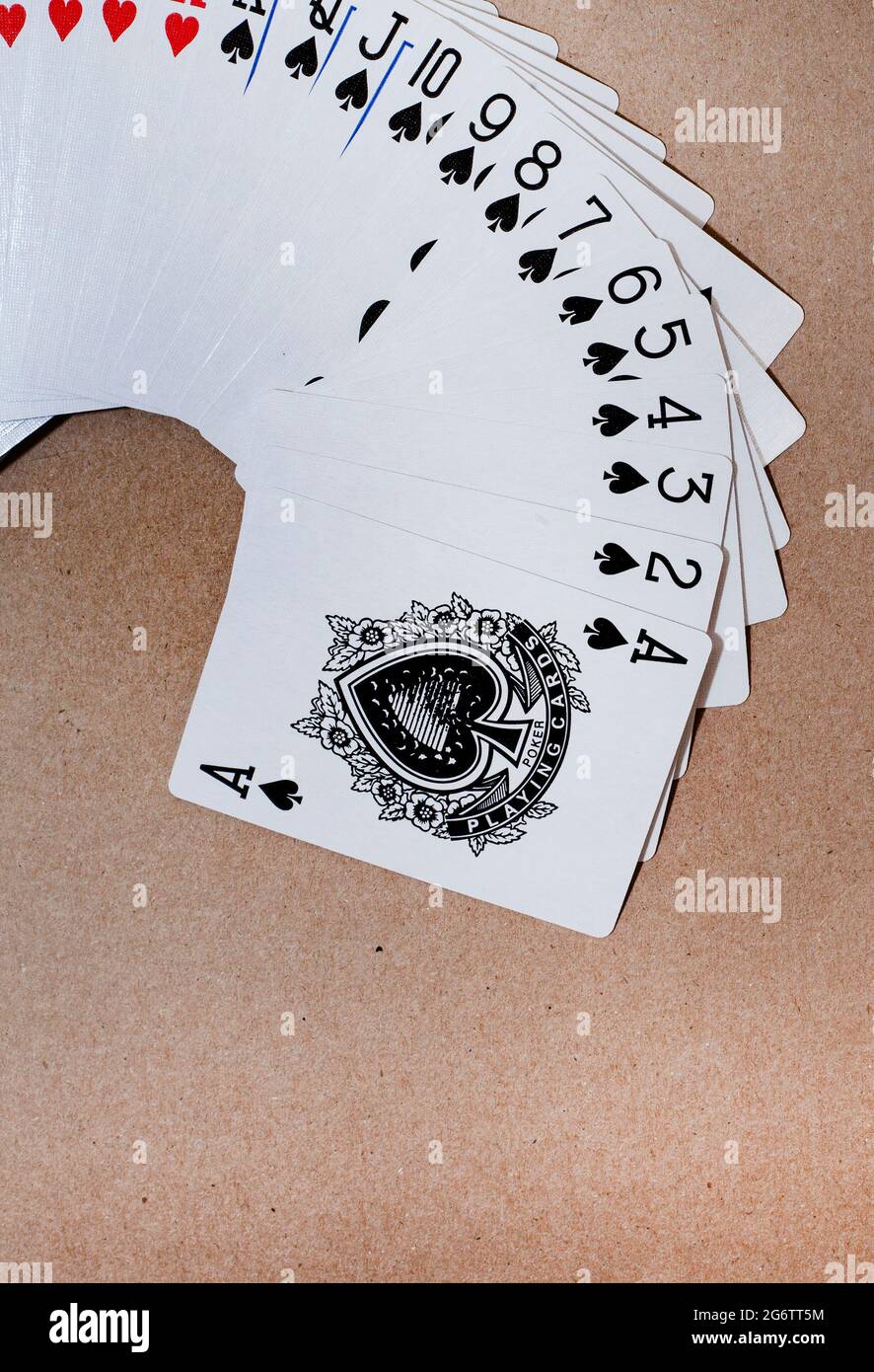 spread of playing cards on neutral surface Stock Photo - Alamy