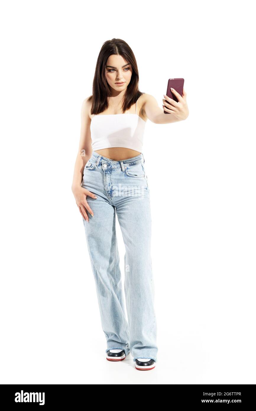 Trendy modern gen Z pretty girl taking photos with smart phone camera ...