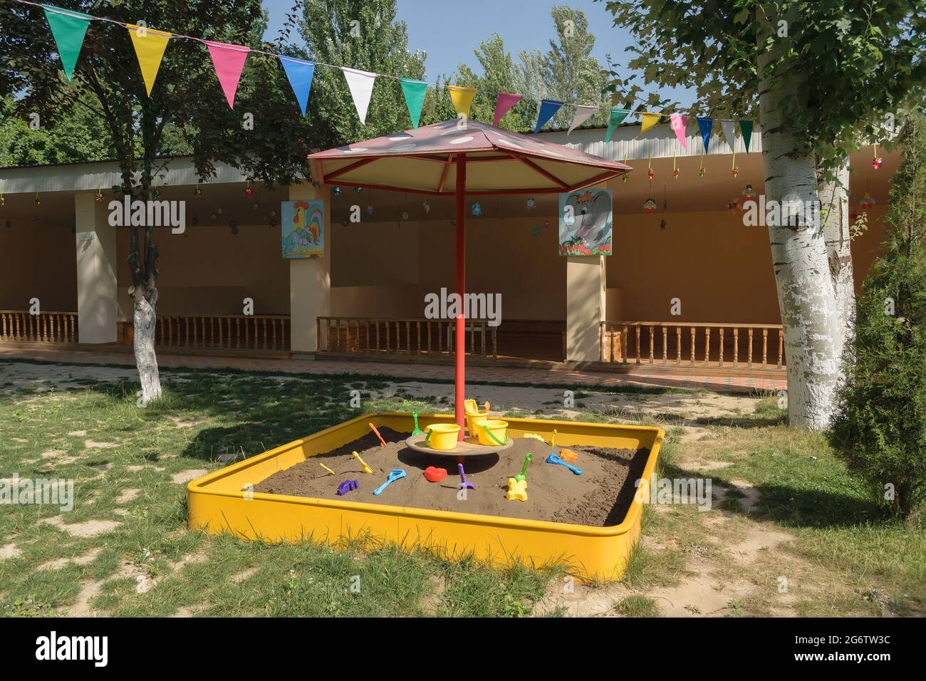 Sandbox in a kindergarten with toys for playing in the sand, with ...