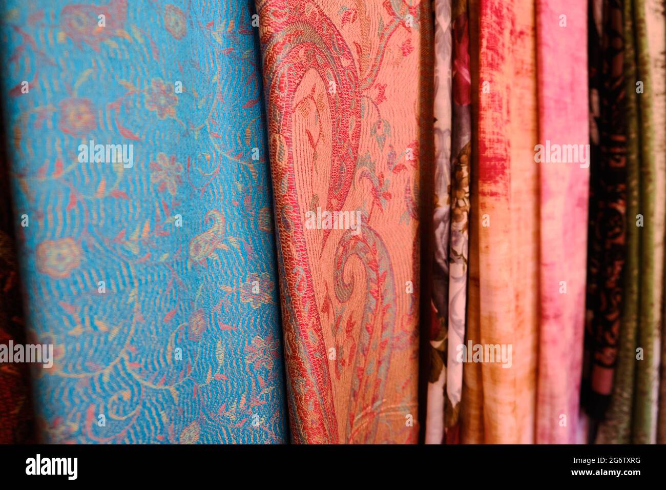 Traditional middle eastern shawls hanging at bazaar Stock Photo - Alamy