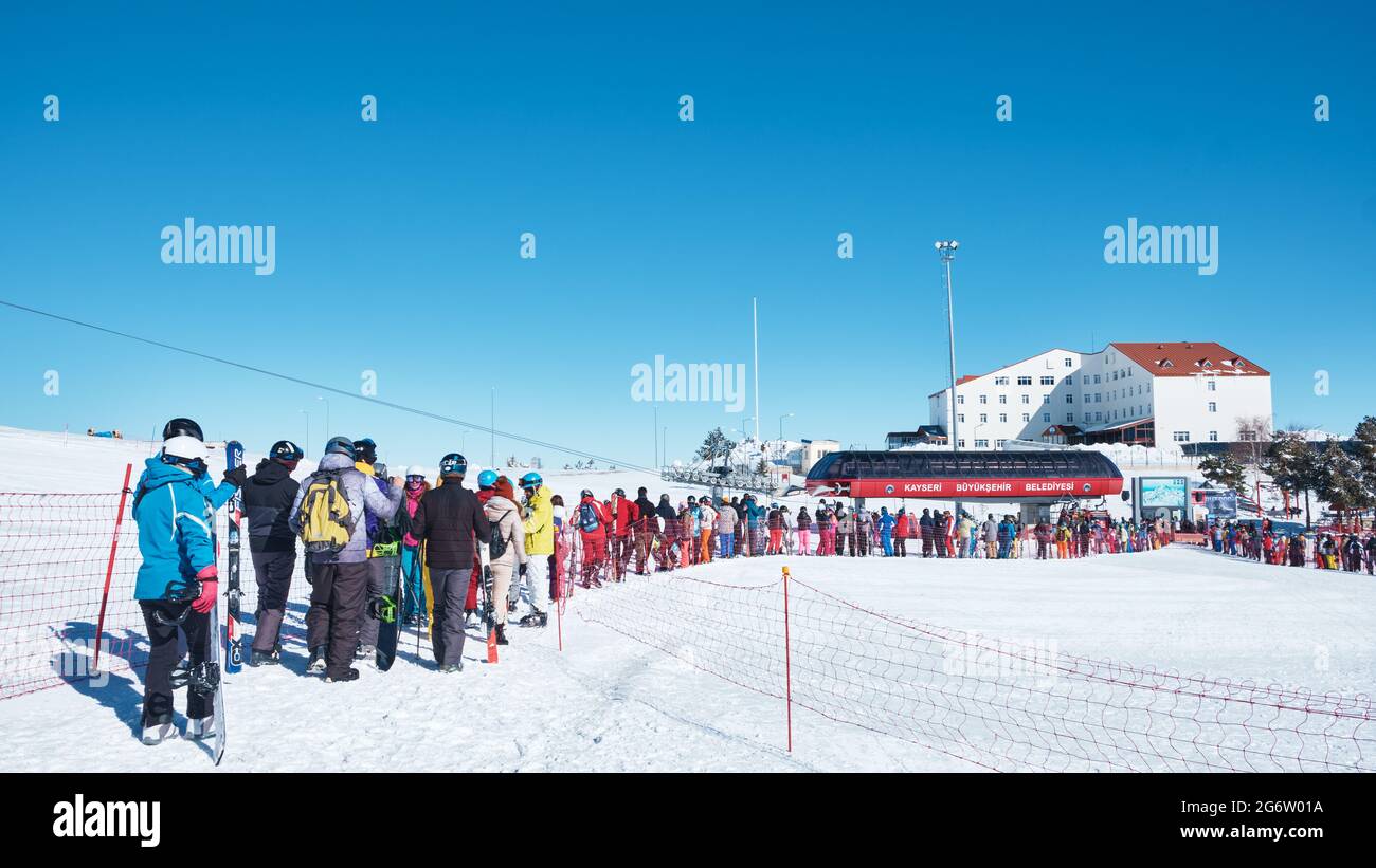 Queue line to cableway at ski resort Stock Photo - Alamy