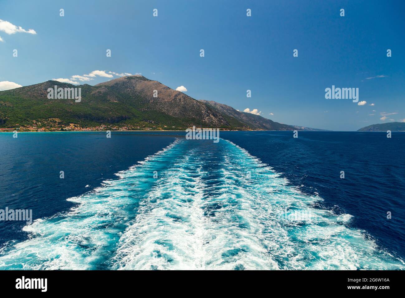 Bright sea water trail behind a cruise ship summer time. Ferry boat ...