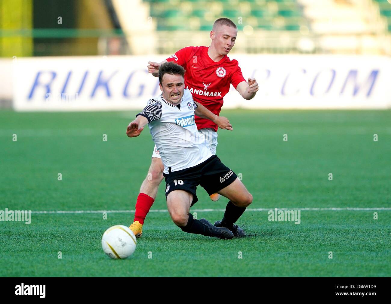 Bala's Paul Rutherford (left) and Larne's Conor McKendry battle for the ...