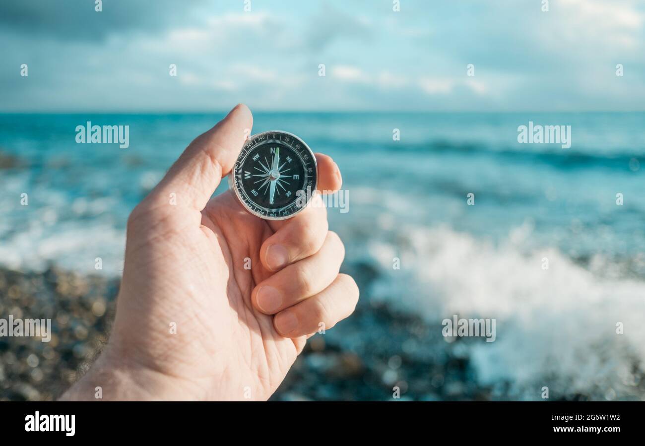 Compass hand hi-res stock photography and images - Alamy