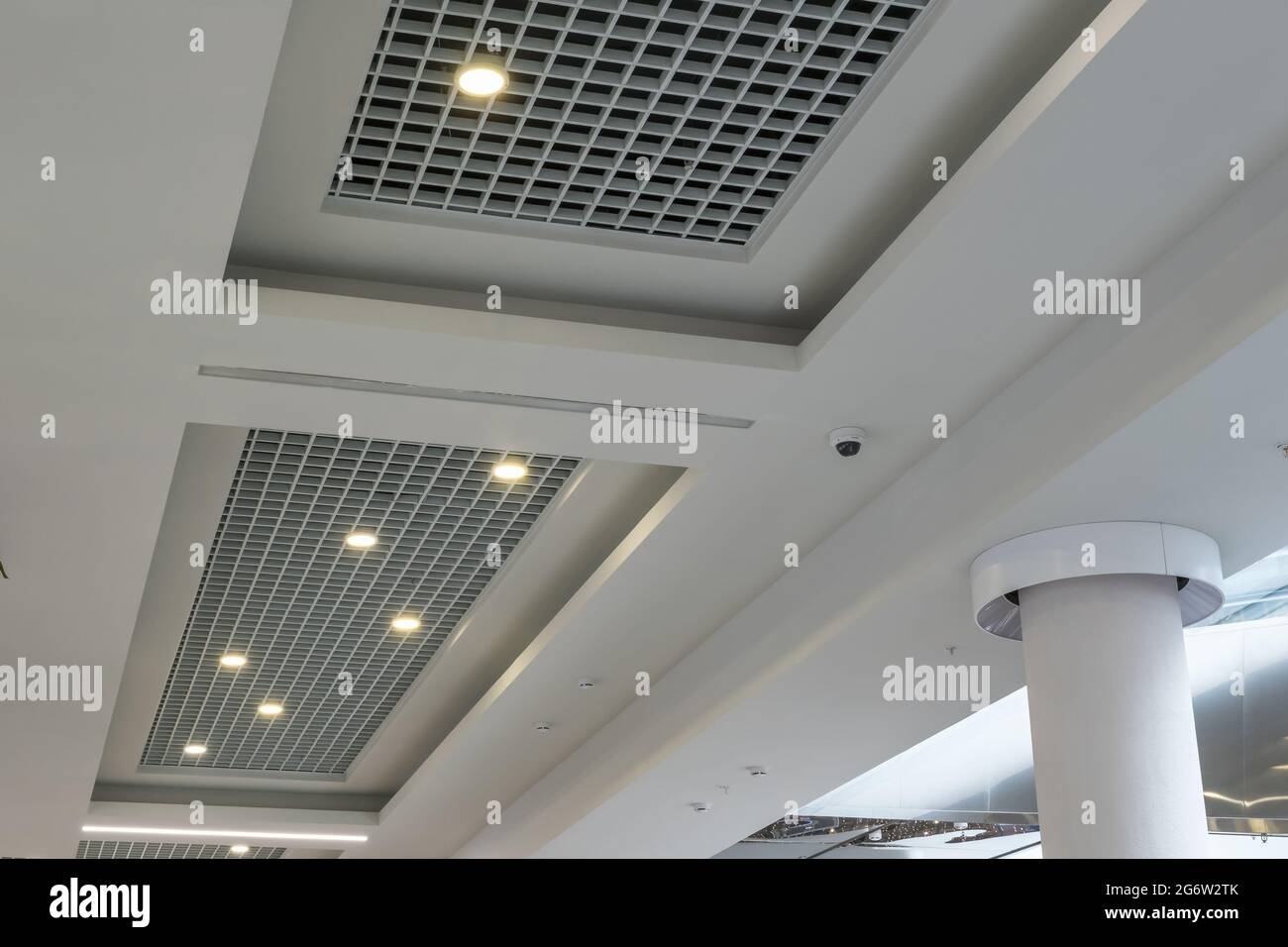 suspended and grid ceiling with halogen spots lamps and drywall ...