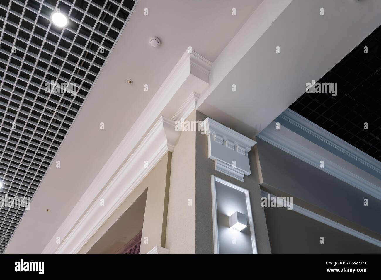suspended and grid ceiling with halogen spots lamps and drywall ...