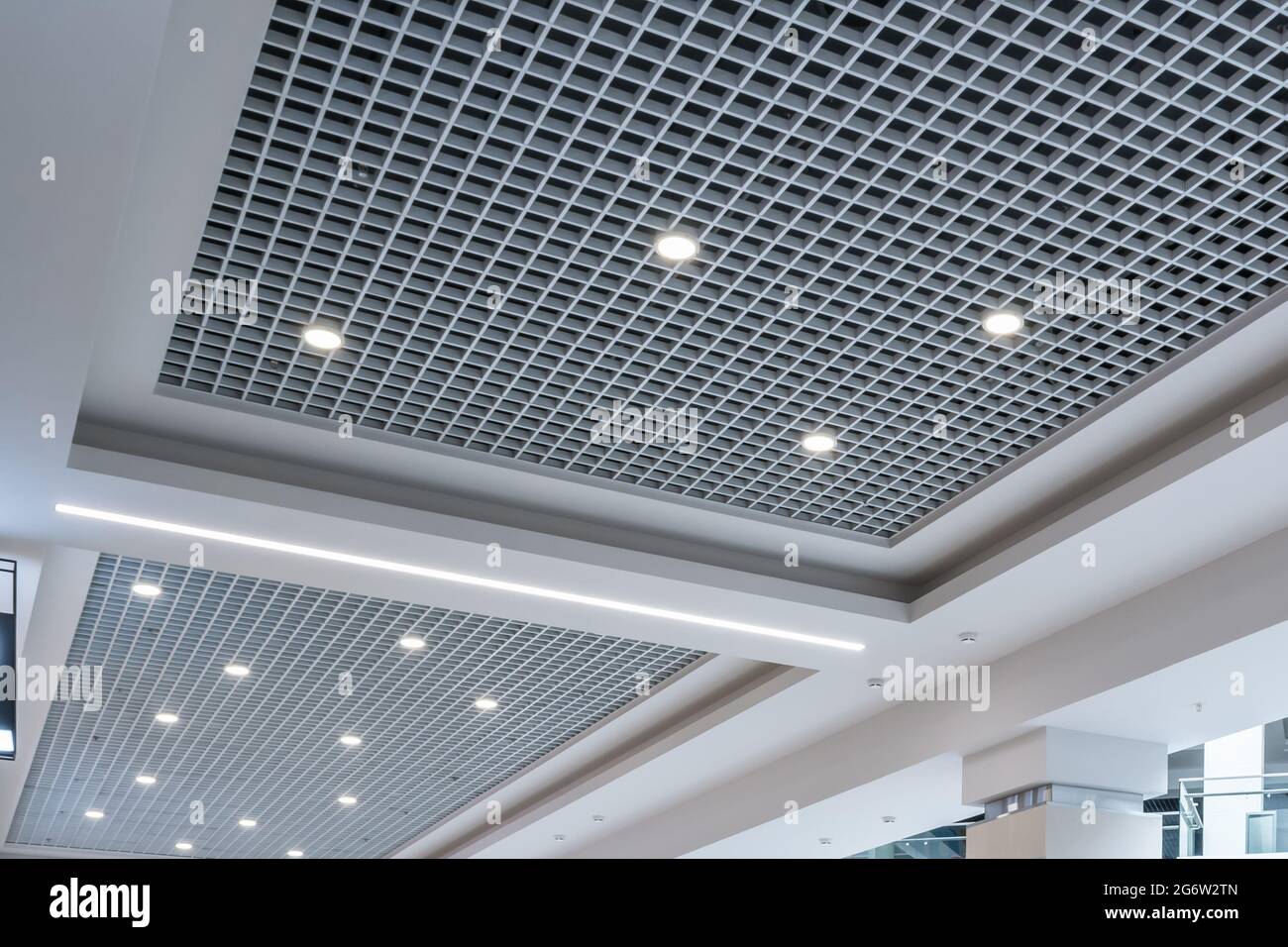 suspended and grid ceiling with halogen spots lamps and drywall ...