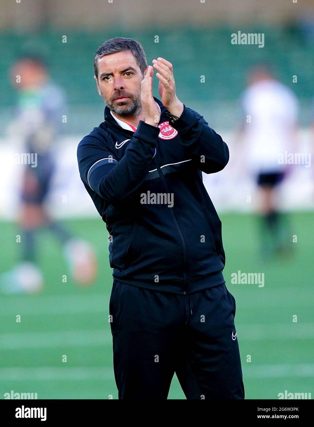 Larne manager Tiernan Lynch applauds the fans at the end of the UEFA Europa Conference League ...