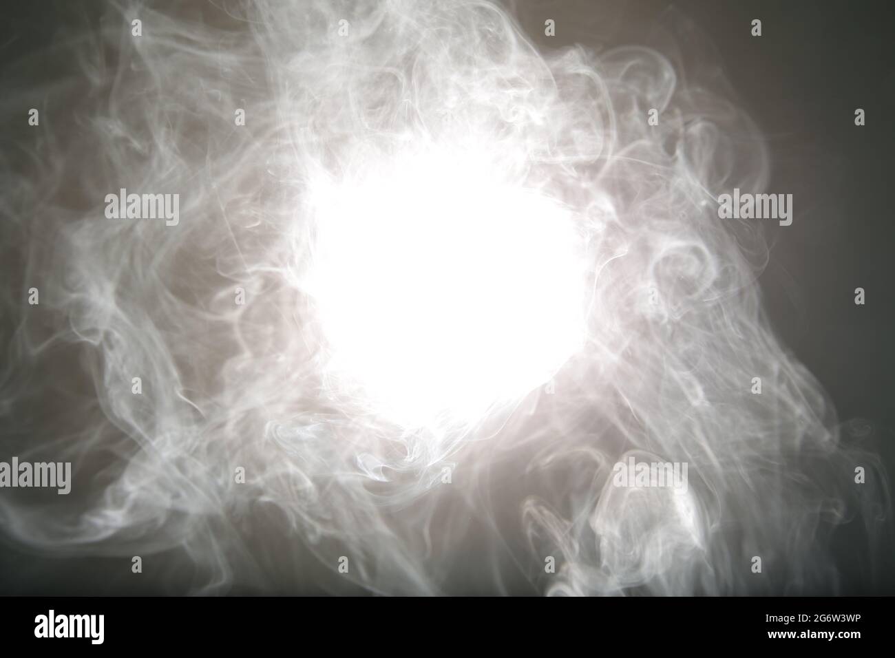 Artificial magic light illuminates smoke isolated on dark background ...