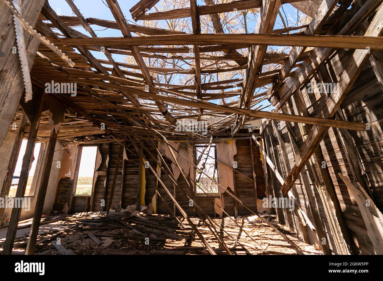 interior of derelict Abandoned building and scrub by the roadside of ...