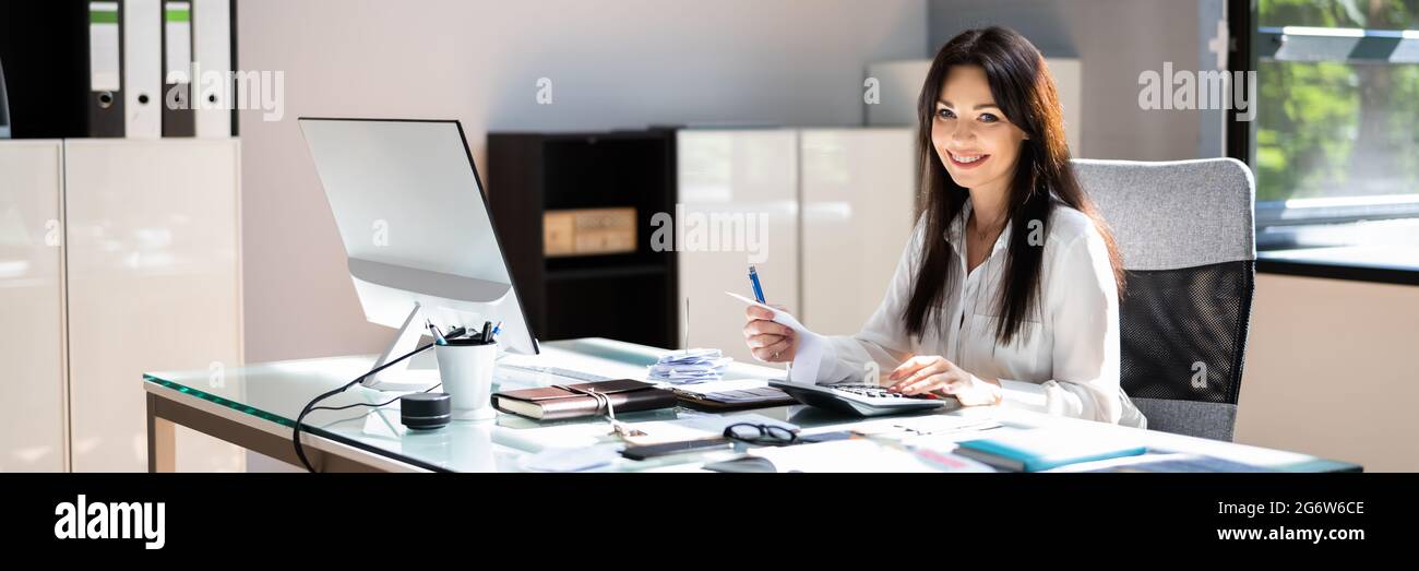 Accountant At Desk Using Finance Technology For Audit Stock Photo - Alamy