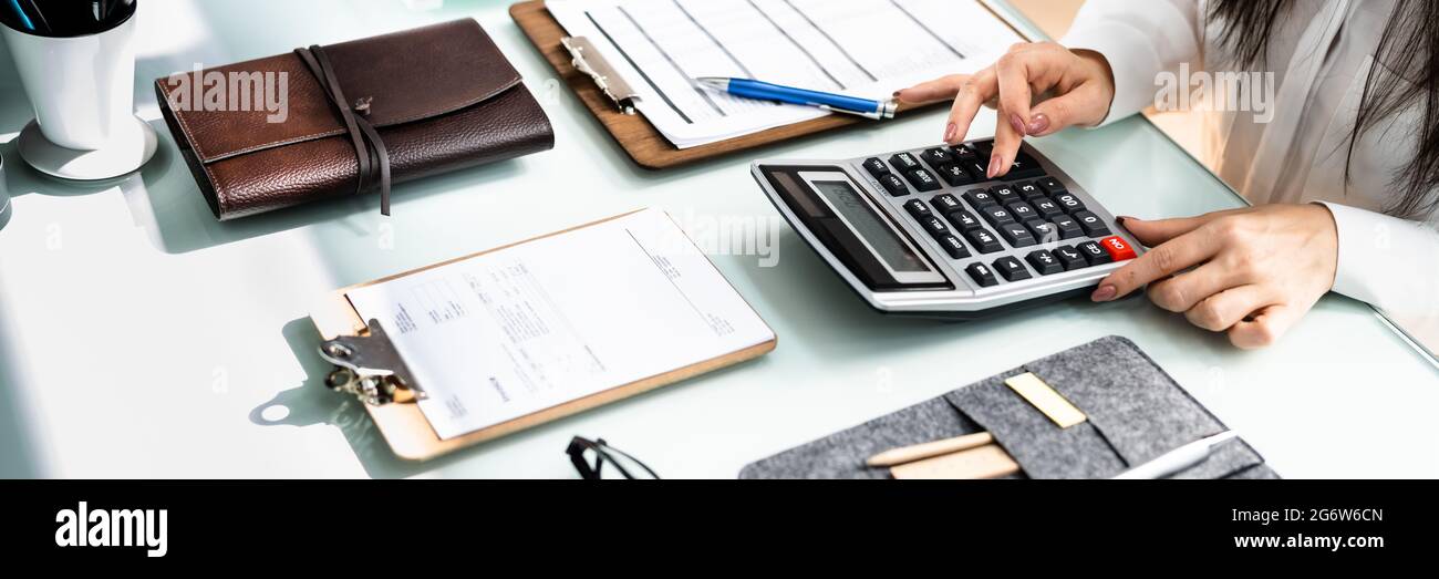 Accountant Doing Tax And Accounting Work Using Calculator Stock Photo ...