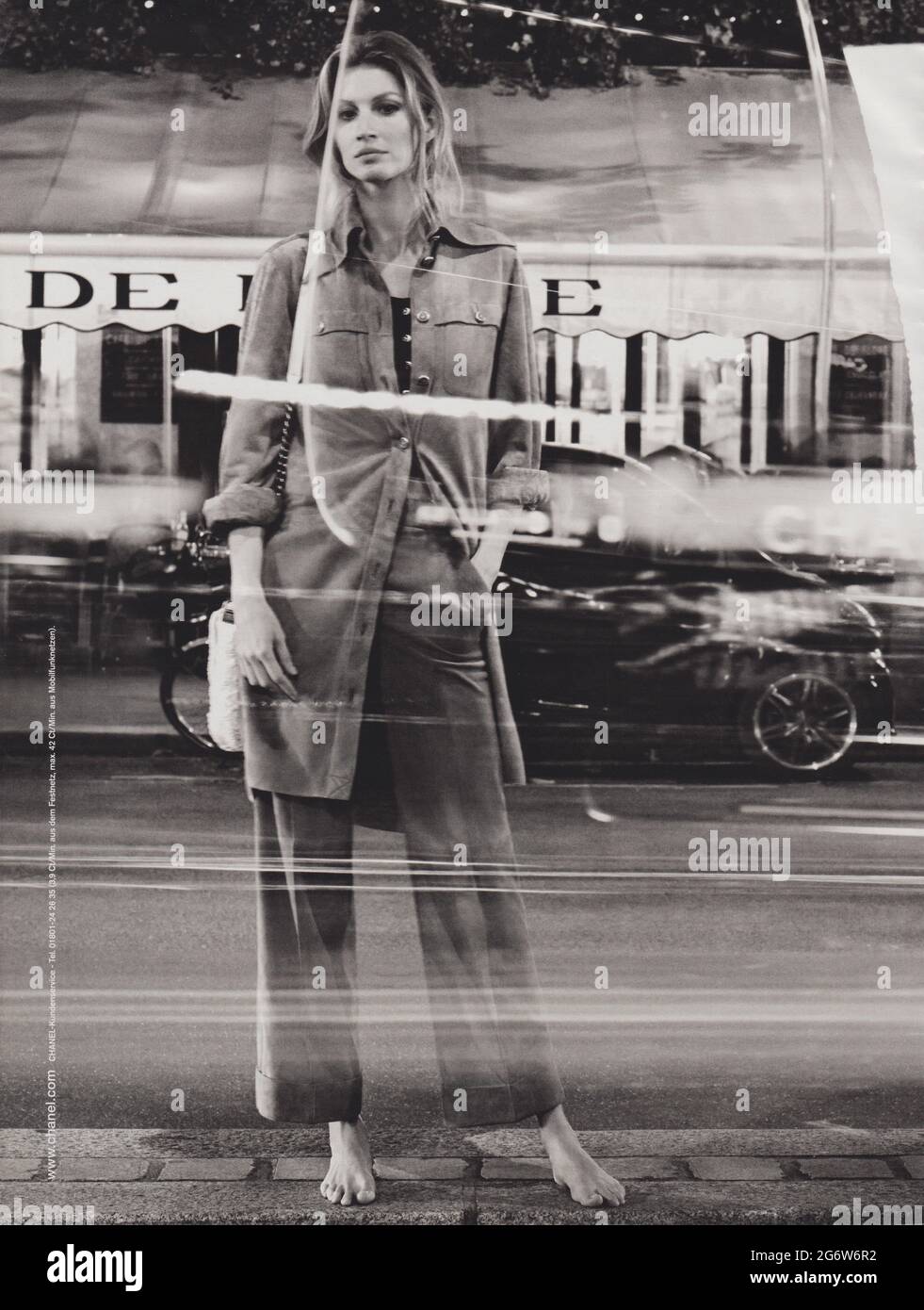 poster advertising CHANEL fashion house with Gisele Bundchen in paper ...