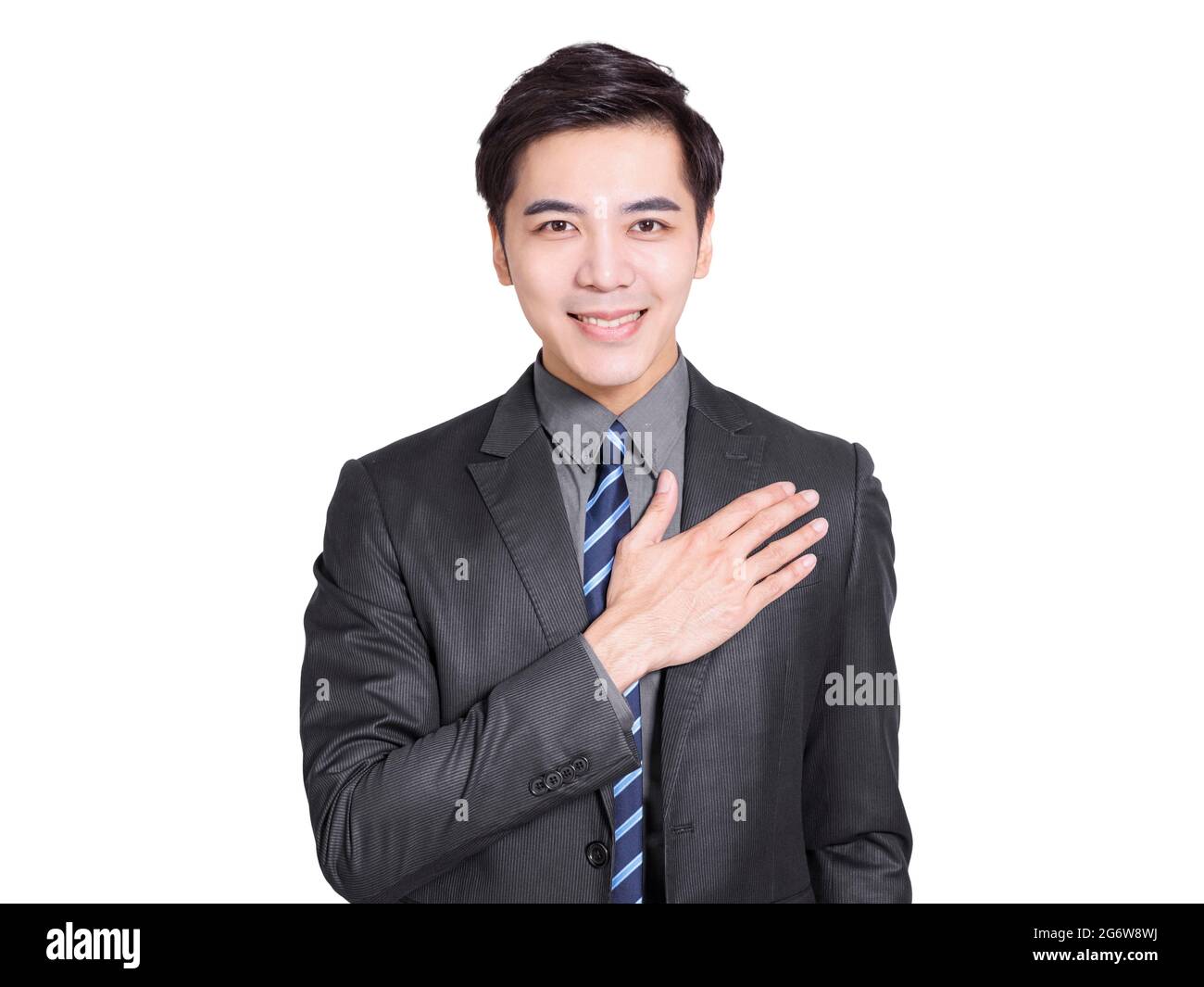 Young businessman with hands on his chest .Isolated on white background ...