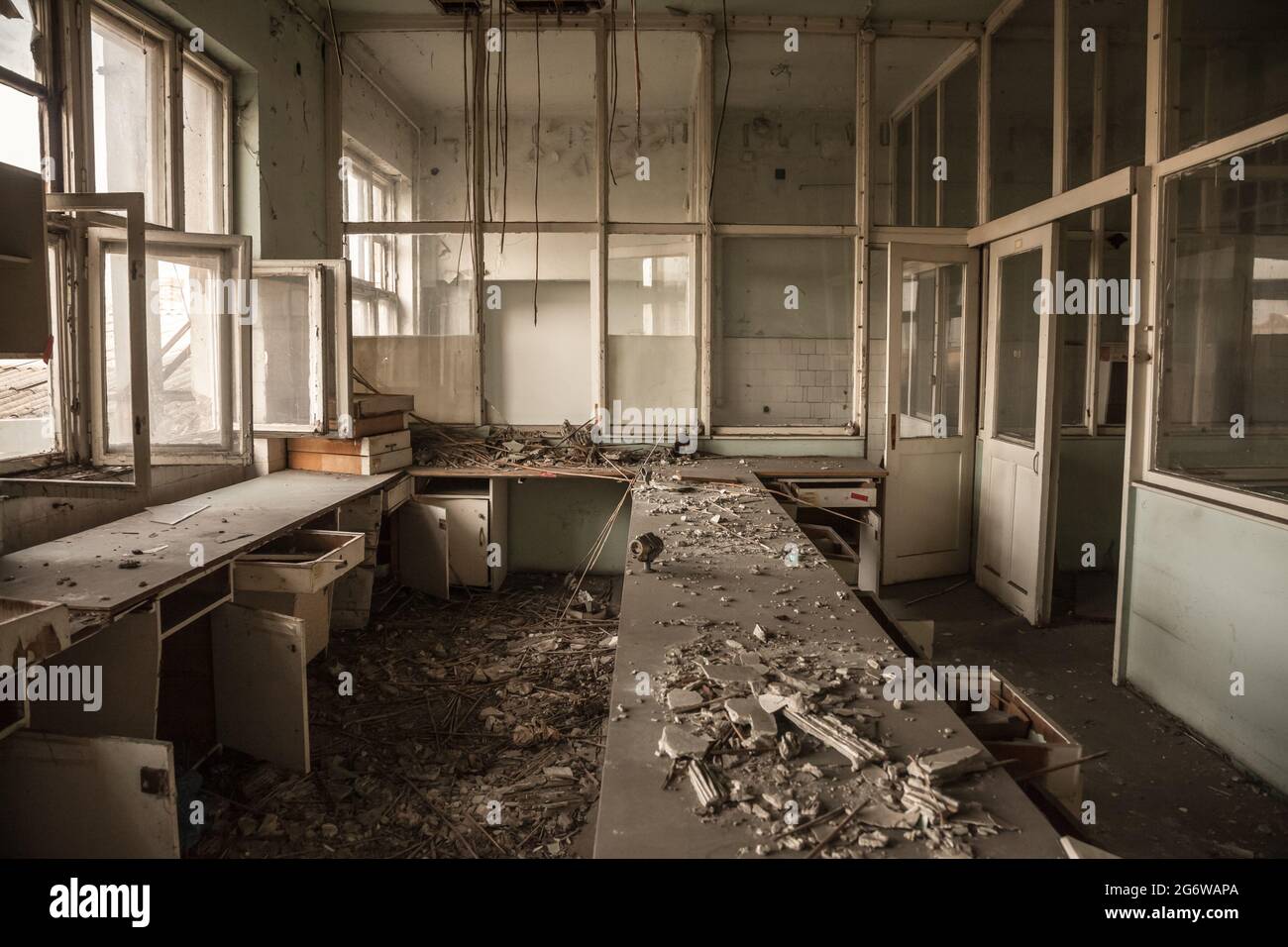 Picture of a damaged interior of an abandoned office building with a ...