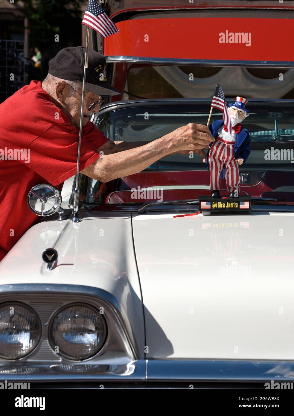 The owner of a 1959 Ford Fairlane puts an Uncle Sam action figure on ...
