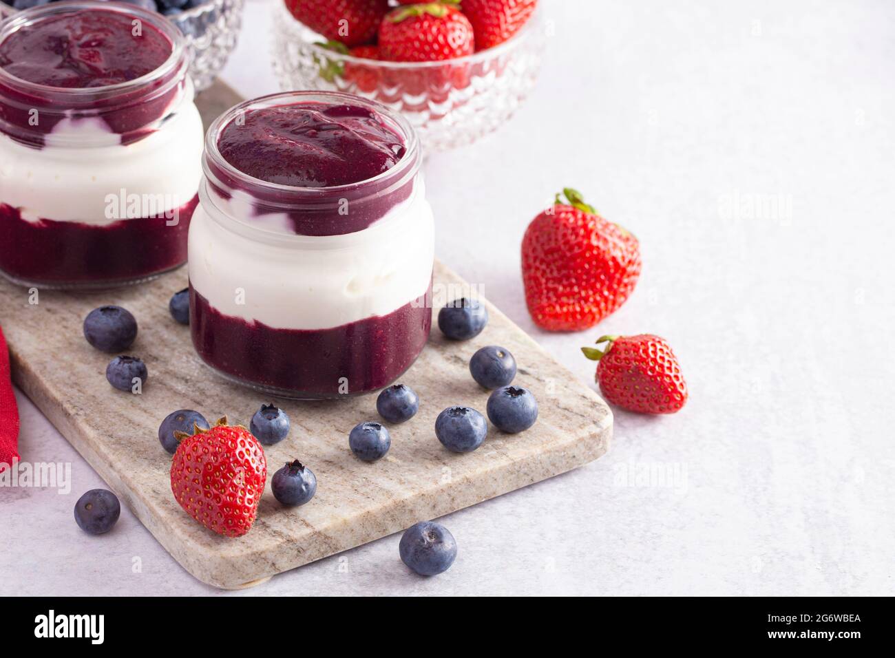 Yogurt and Berry Puree in a Glass Jar for a Healthy Breakfast Stock ...