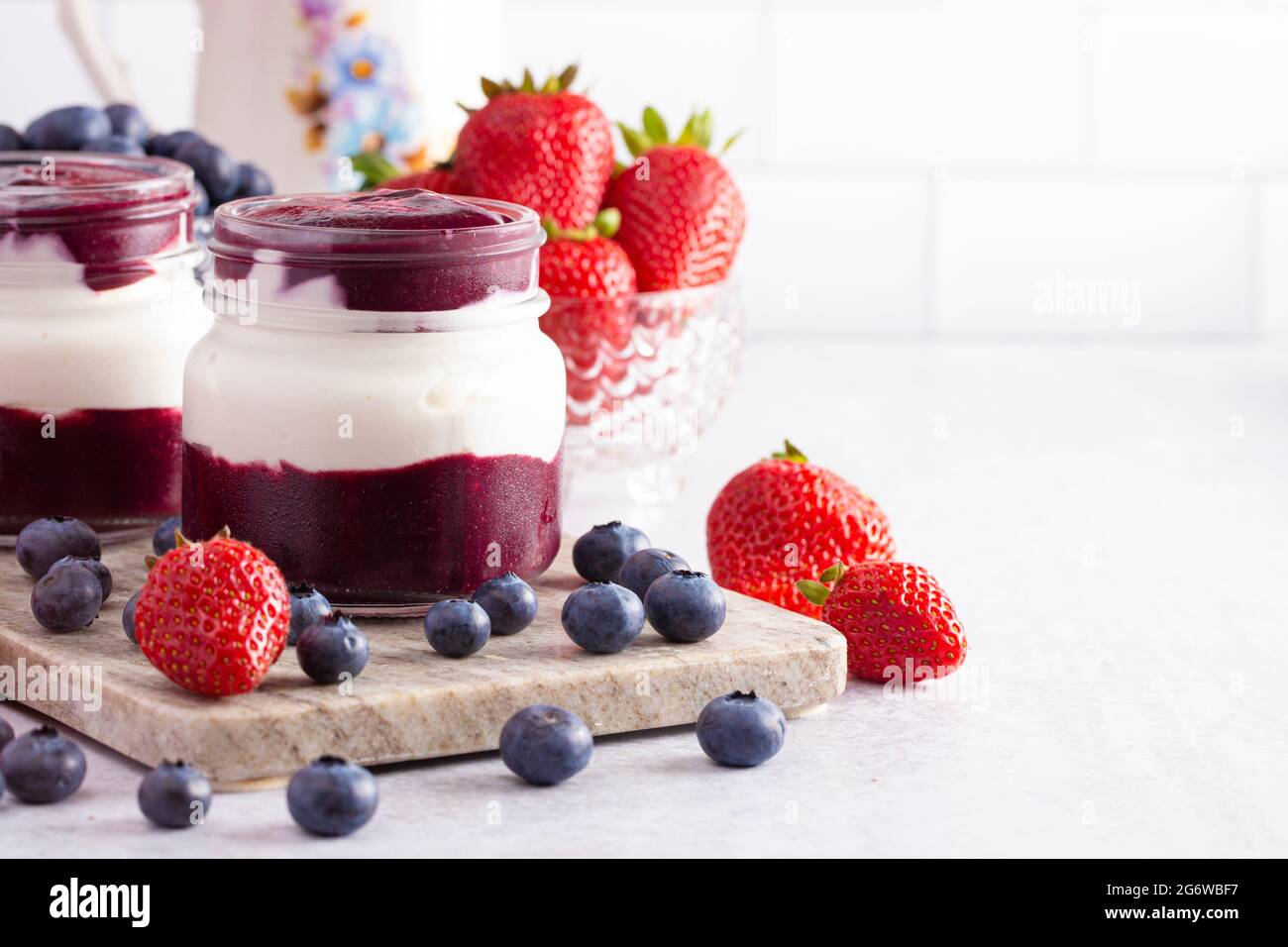 Yogurt and Berry Puree in a Glass Jar for a Healthy Breakfast Stock ...