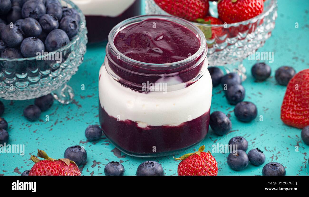 Yogurt and Berry Puree in a Glass Jar for a Healthy Breakfast Stock ...