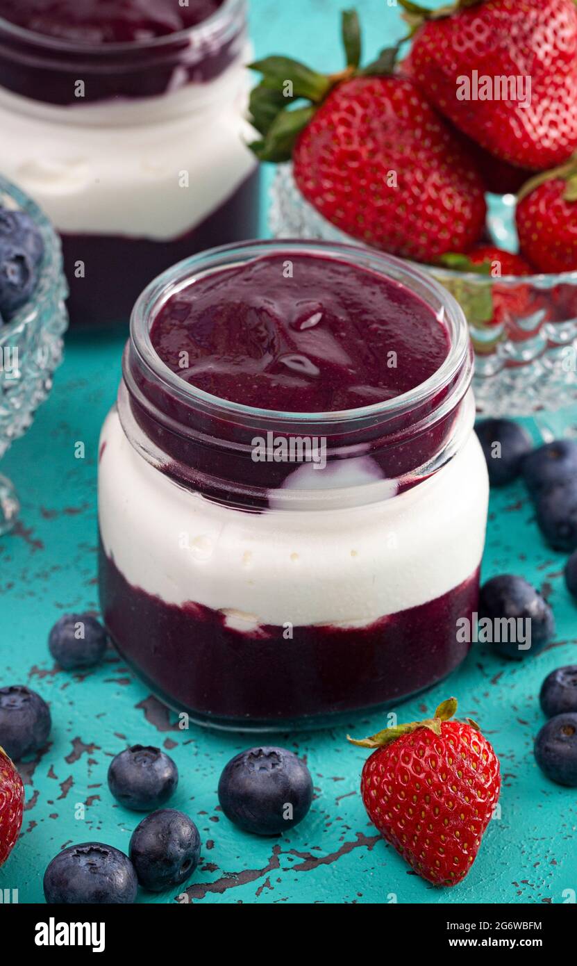 Yogurt and Berry Puree in a Glass Jar for a Healthy Breakfast Stock ...