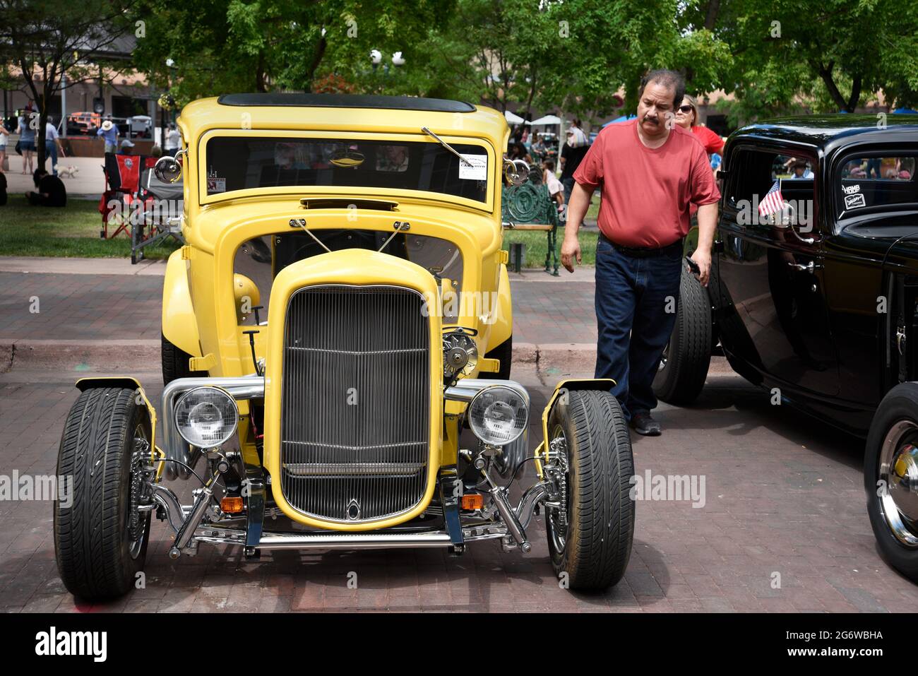 A customized hot rod on display at a Fourth of July classic car show in ...