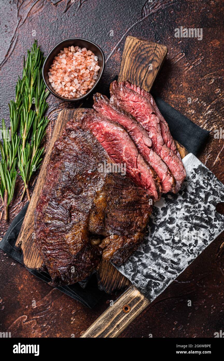 Roasted hanging tender or Onglet sliced beef meat steak on a butcher ...