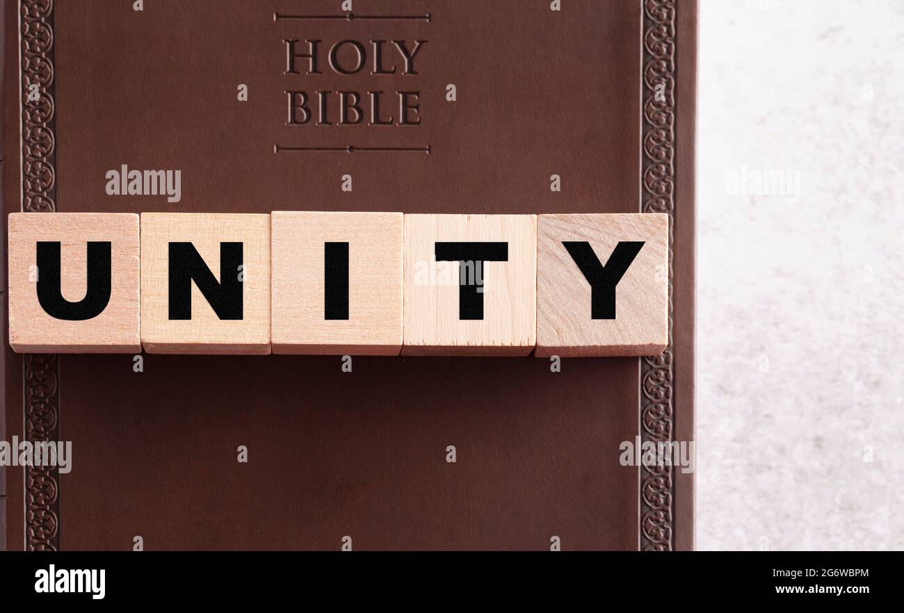 Unity Spelled in Blocks on a Brown Leather Holy Bible Stock Photo - Alamy