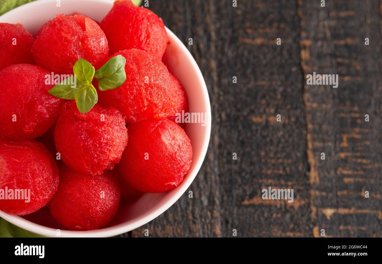 Juicy Watermelon Balls on a Dark Wood Surface Stock Photo - Alamy