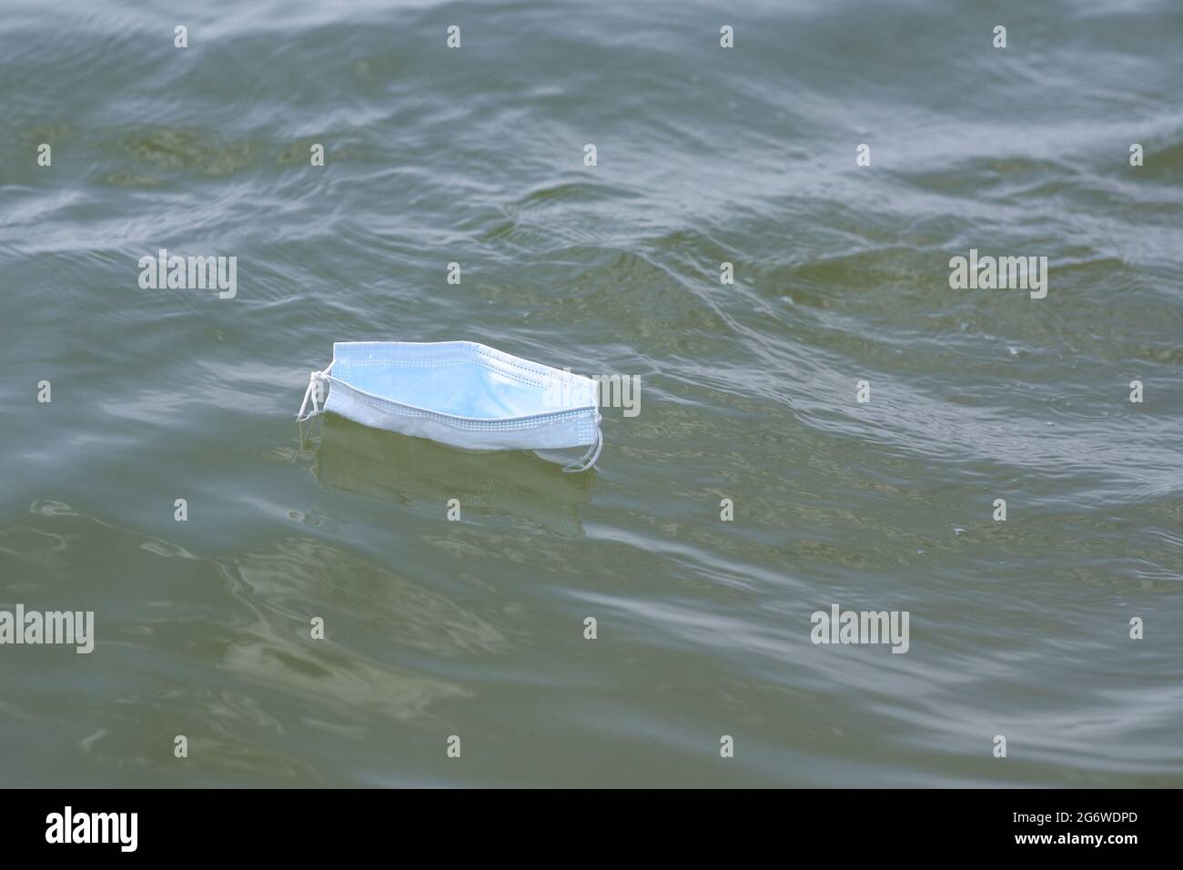 a medical mask floats on the water. a mask in the form of a boat Stock ...