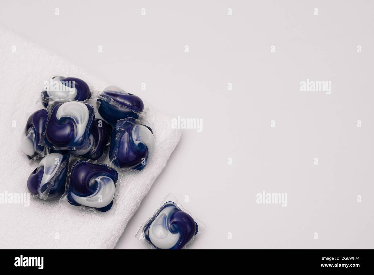 gel capsules for the washing machine are blue. copy space Stock Photo ...