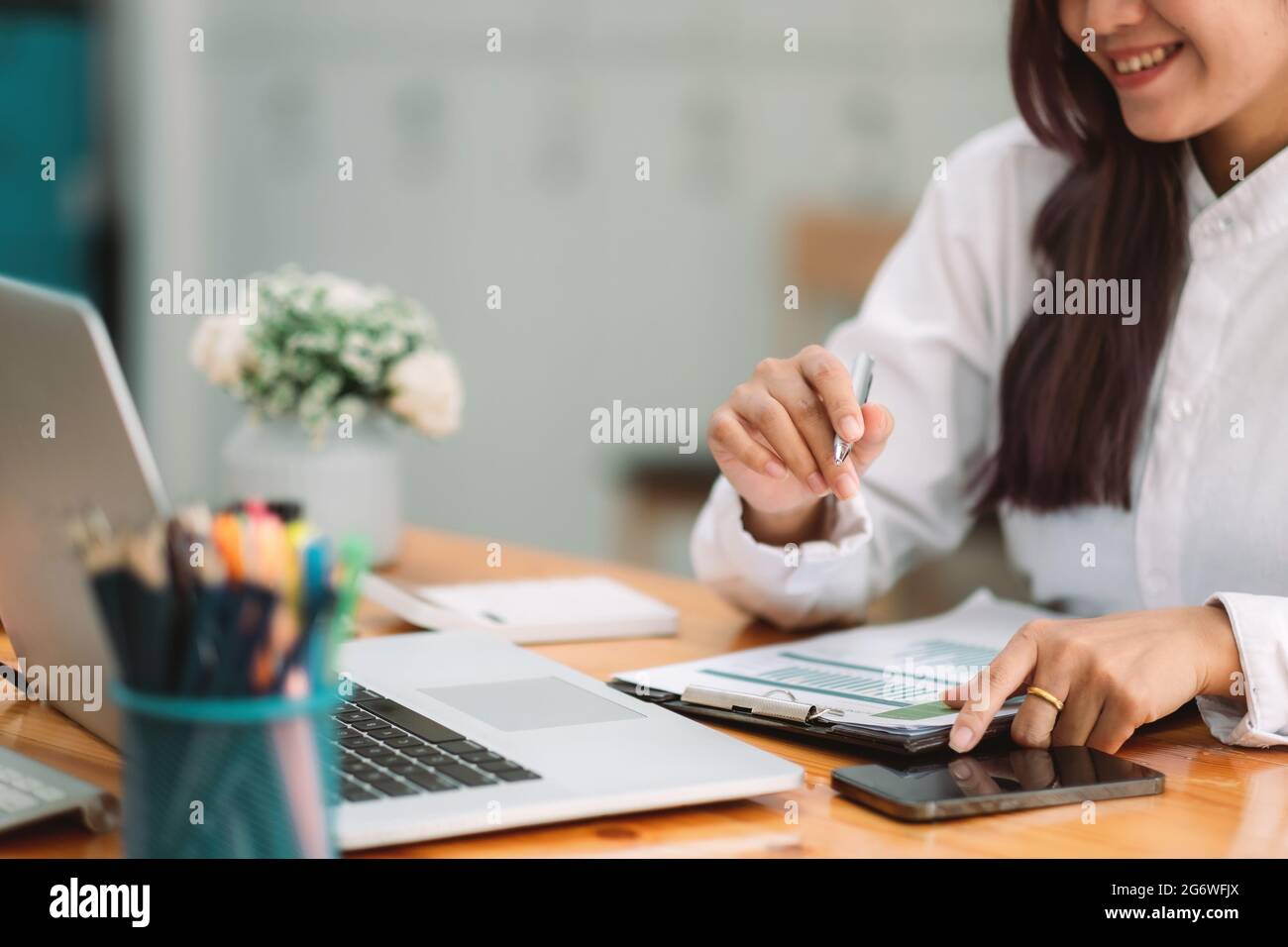 Businesswoman using calculator for analysis maketing plan, Accountant ...