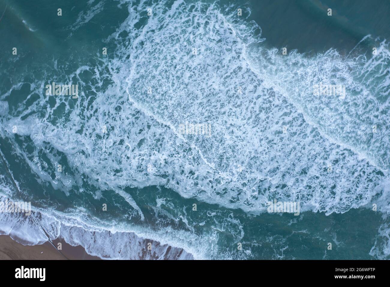 Sea wave running on a shallow coastal strip Stock Photo - Alamy