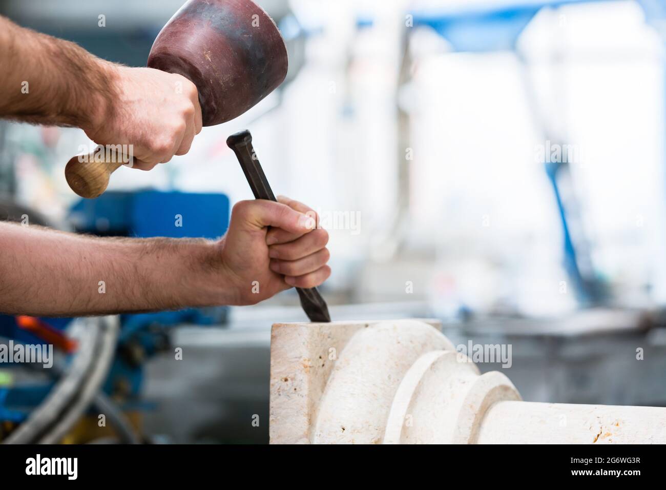 Stone carver working at marble pillar Stock Photo - Alamy