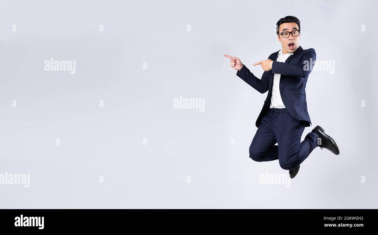 Portrait of business man wearing suit, isolated on white background ...