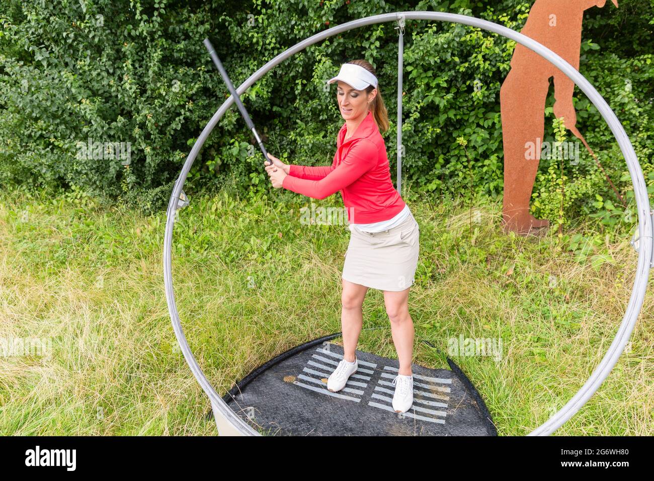 Close up a woman practising to driving golf on golf driving range Stock ...