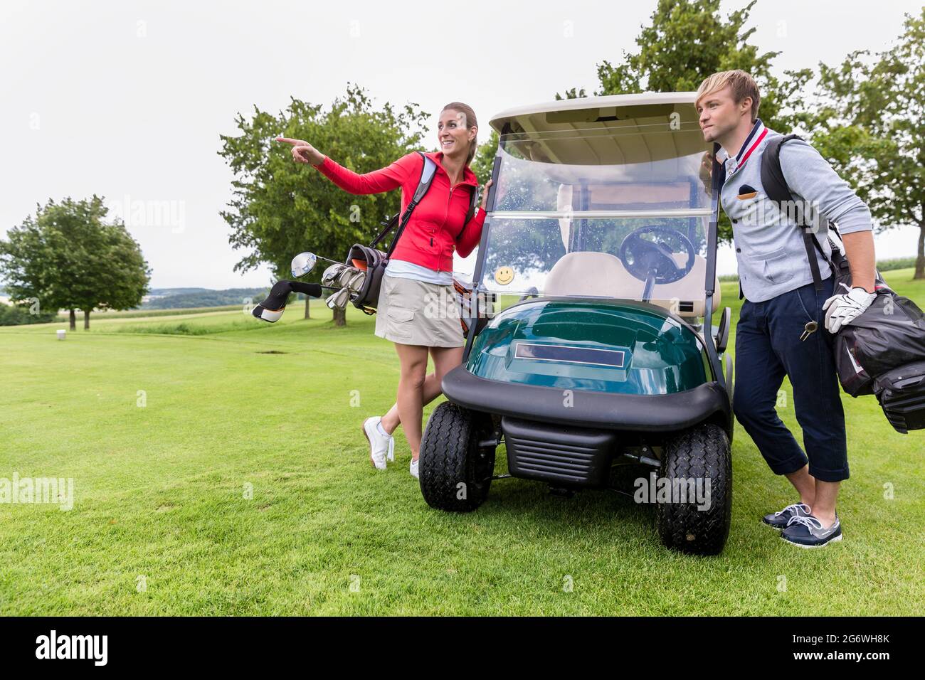 Smiling woman near cart hi-res stock photography and images - Alamy