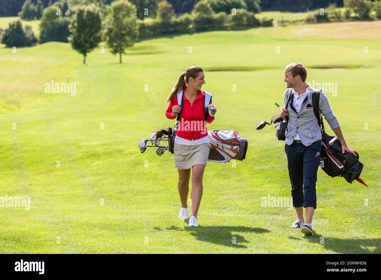 Caddy carrying golf bag hi-res stock photography and images - Alamy