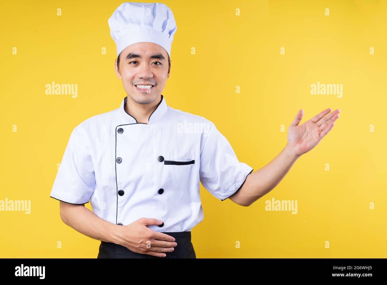 male chef portrait, isolated on yellow background Stock Photo - Alamy