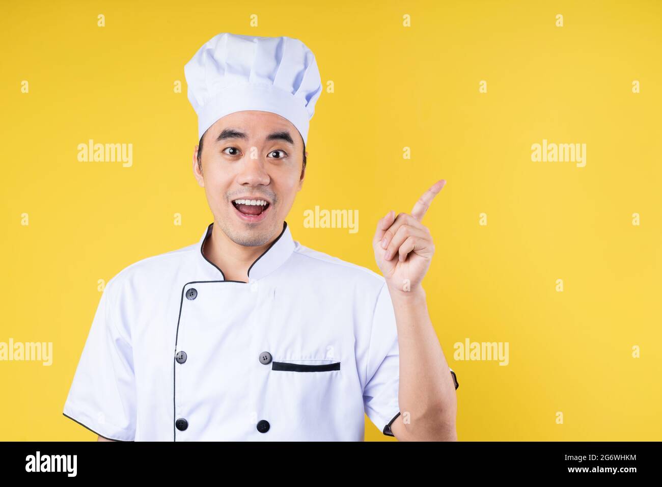 male chef portrait, isolated on yellow background Stock Photo - Alamy