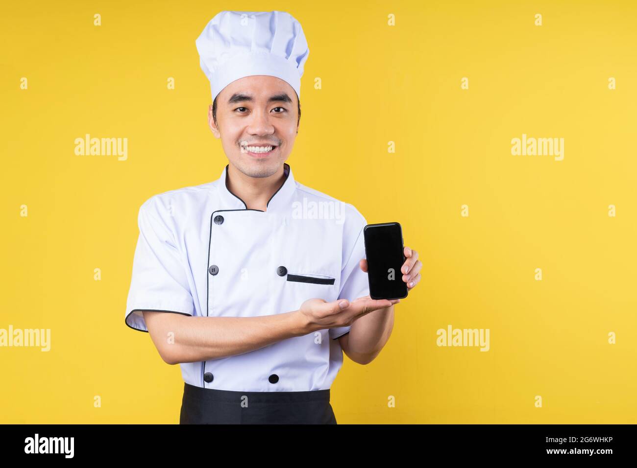 male chef portrait, isolated on yellow background Stock Photo - Alamy