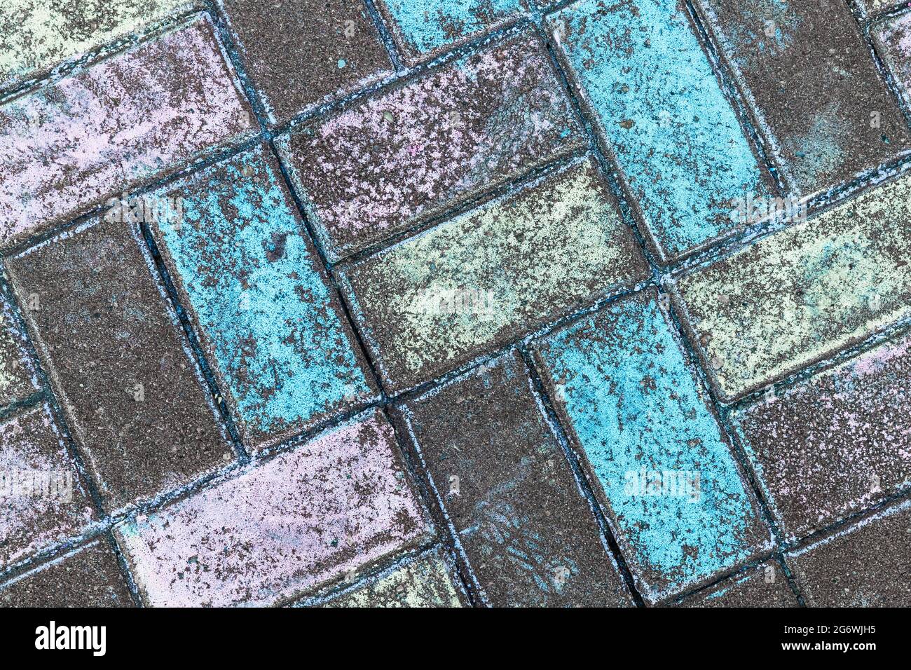 Colorful cobble stones painted with chalk, road pavement, photo texture ...